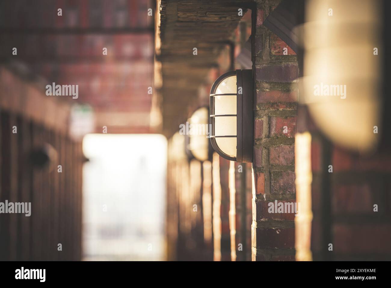 Lamps on a masoned building, blurry background Stock Photo - Alamy