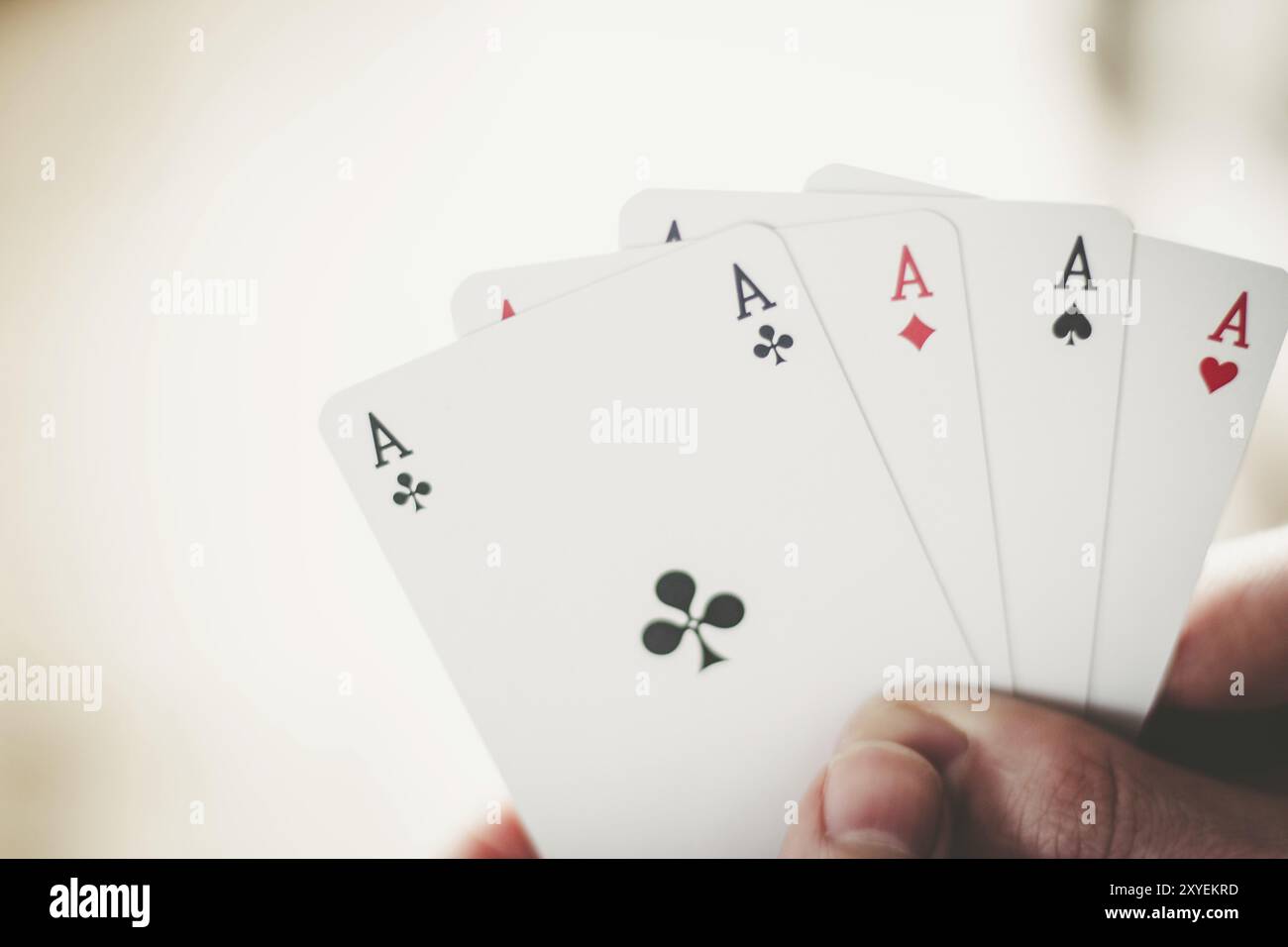 Young man is playing cards, cutout of his hands Stock Photo - Alamy