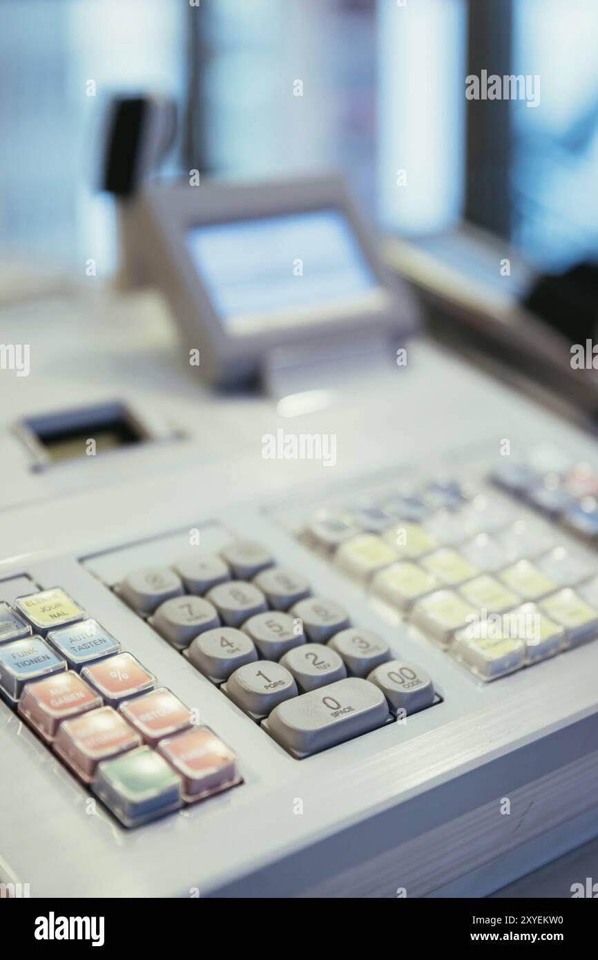 Cash register in a shop: Customer is paying purchase Stock Photo - Alamy
