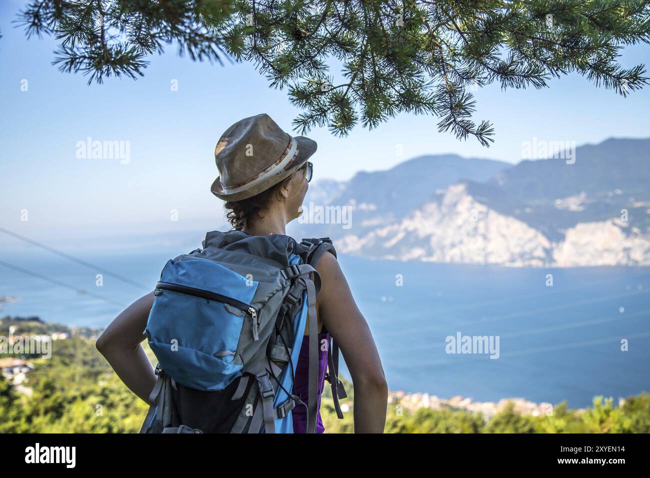 Hiking in Italy: Girl with straw hat is enjoying the view, summertime ...