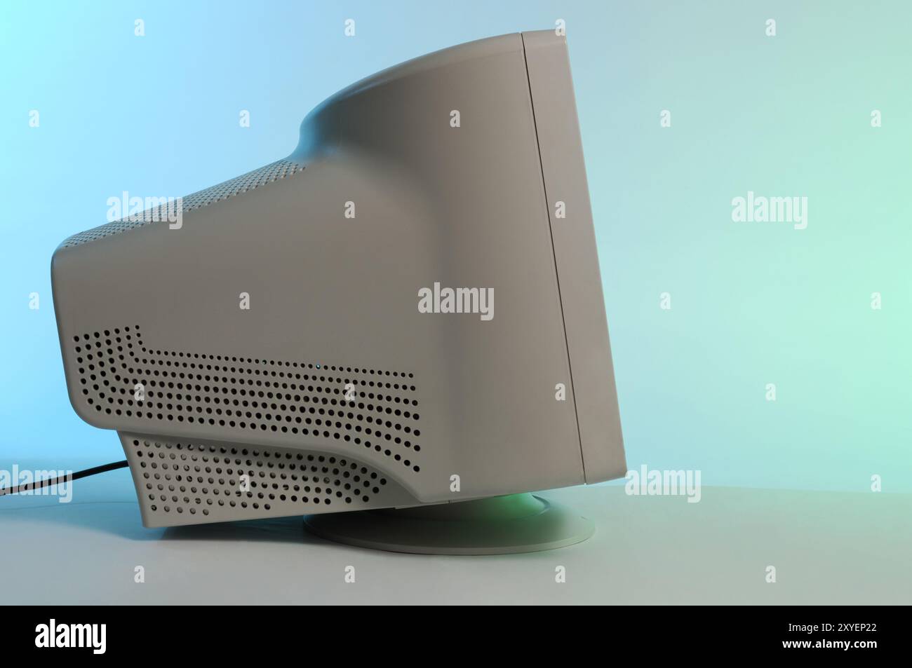 CRT monitor side view close-up isolated on blue Stock Photo - Alamy