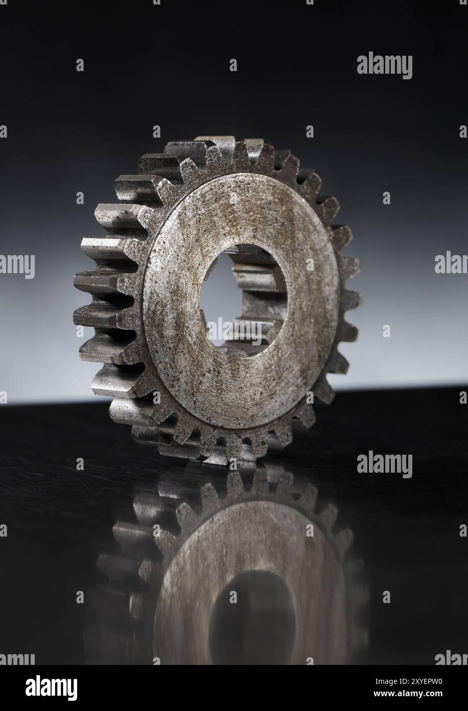 Old rusty cog gear wheel on metallic surface, Short depth-of-field ...
