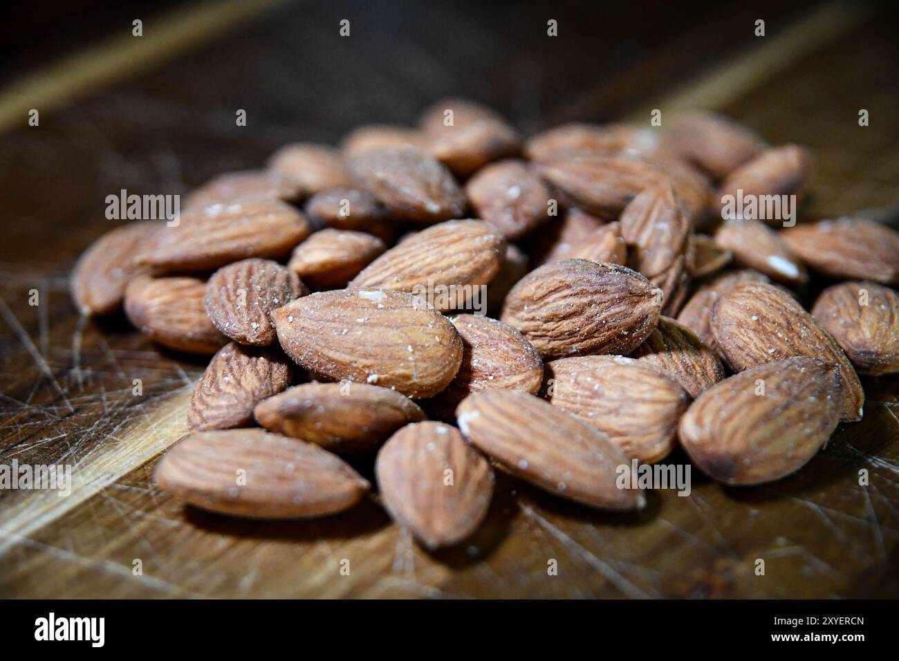 Almonds roasted hand close hi-res stock photography and images - Alamy