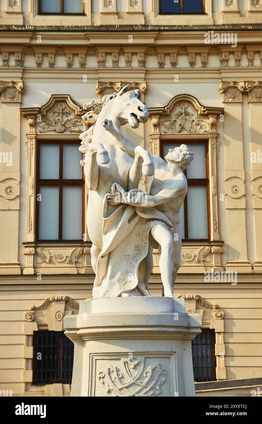 Upper Belvedere Palace in Vienna, Austria. Baroque statue of horse next ...