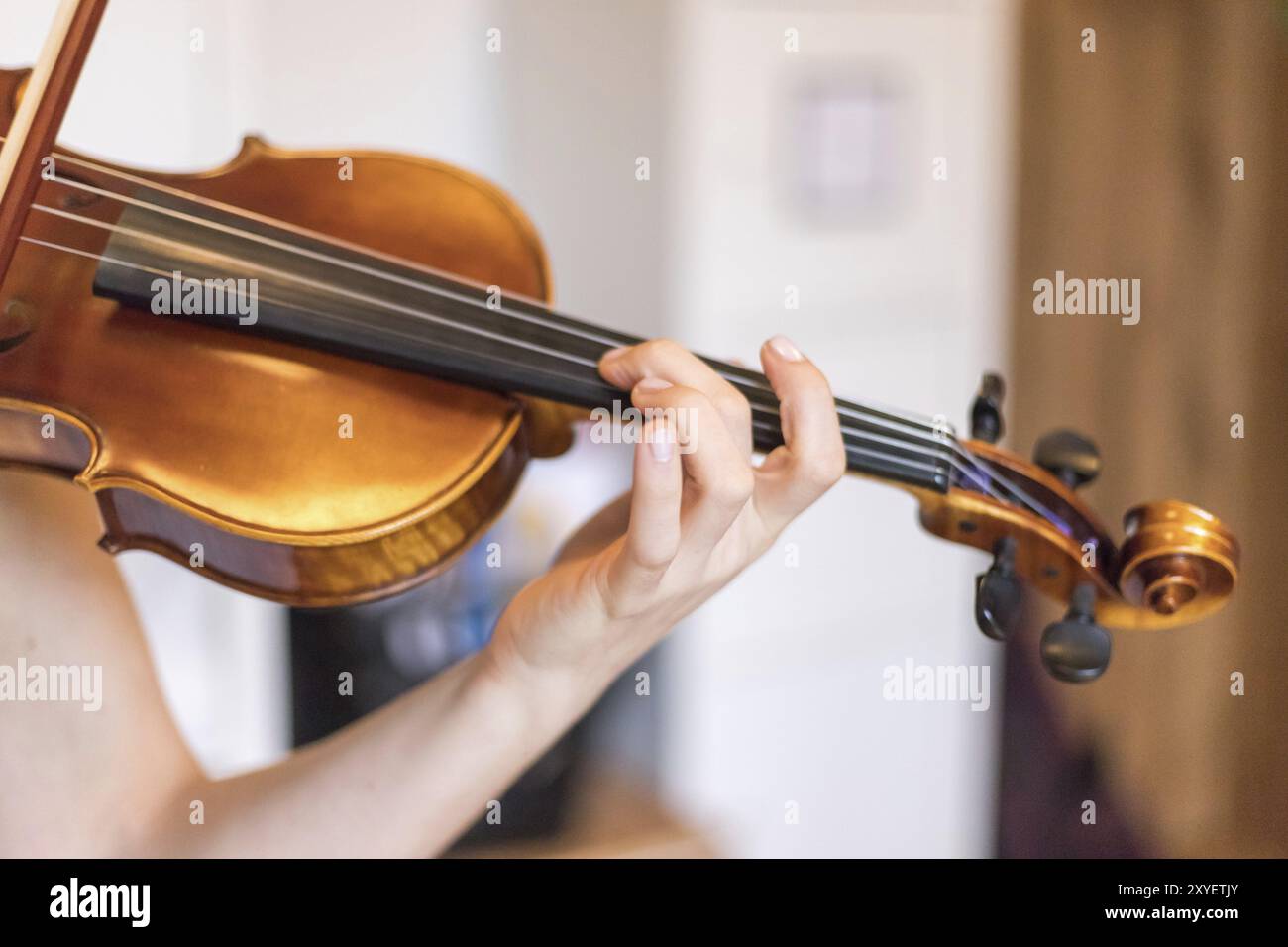 Pretty young girl practices on her violin, acoustic music Stock Photo ...