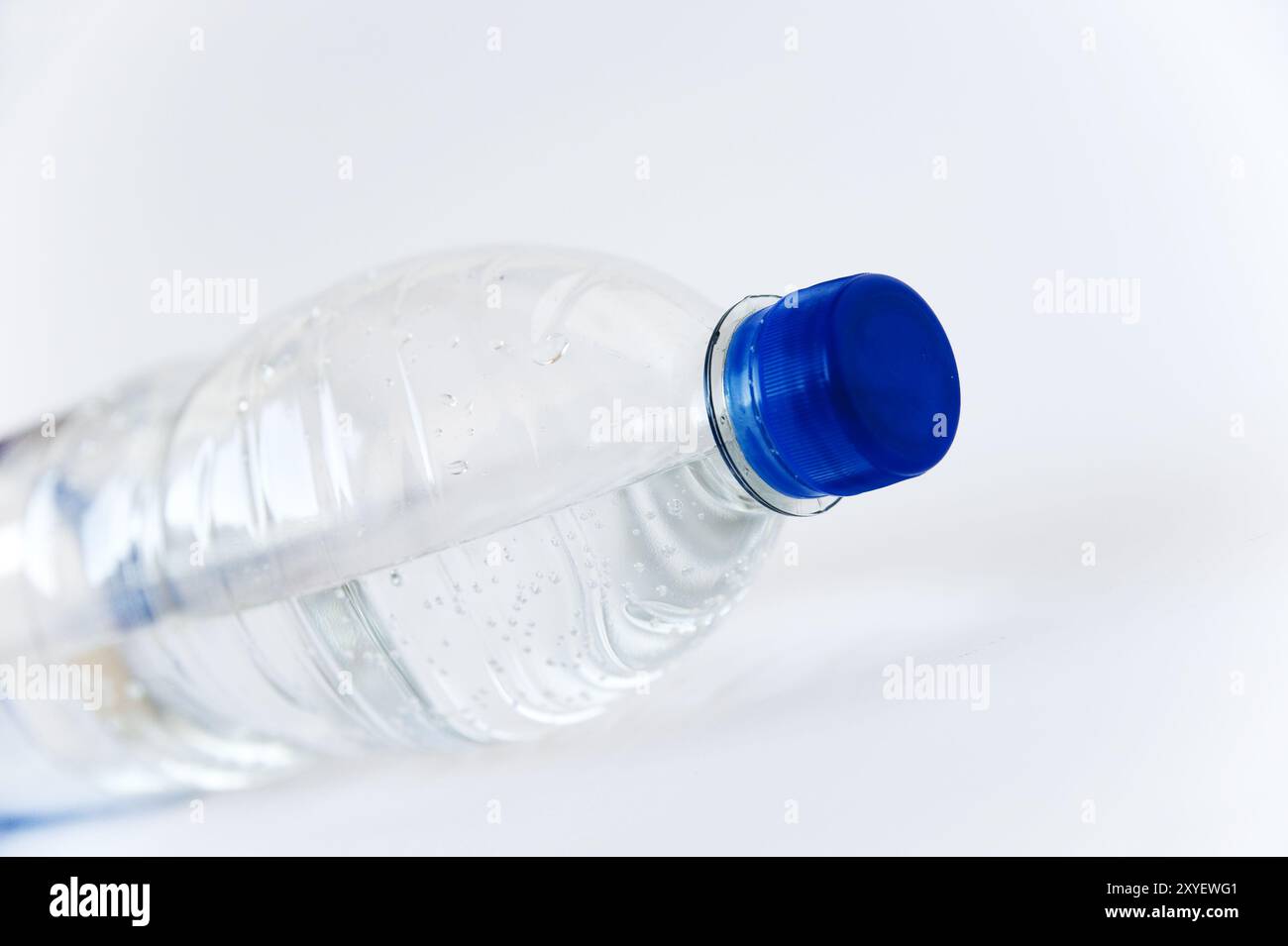 Horizontal water bottle half full Stock Photo - Alamy