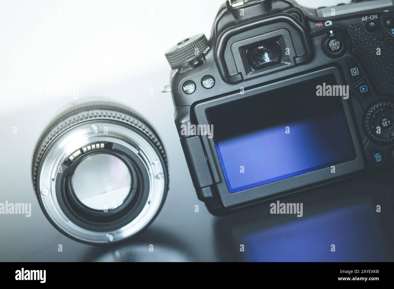 Back view of a professional reflex camera with flip lsd screen and a ...