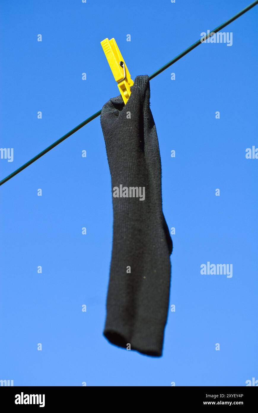 Black sock on the line Stock Photo - Alamy
