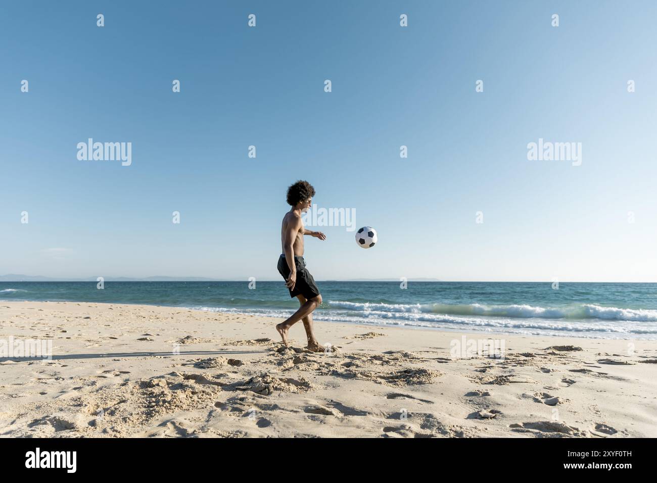 Man kicking ball hi-res stock photography and images - Alamy