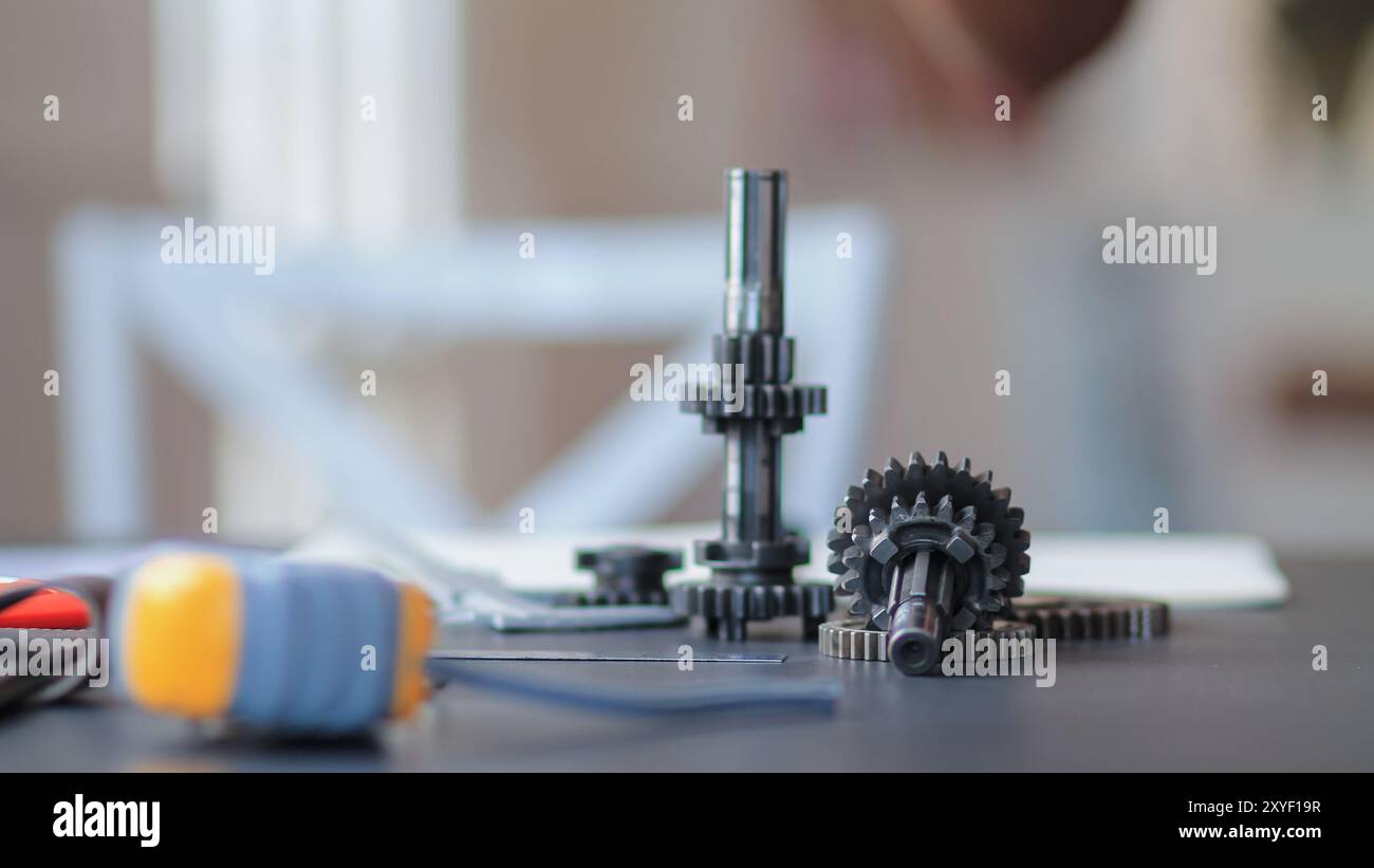 The gear set is placed on the workbench of a team of factory mechanical ...