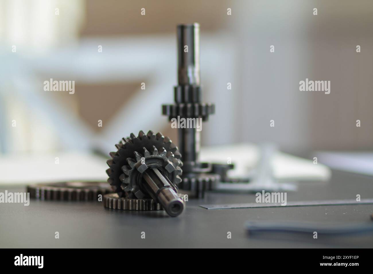 The gear set is placed on the workbench of a team of factory mechanical engineers to study and ...