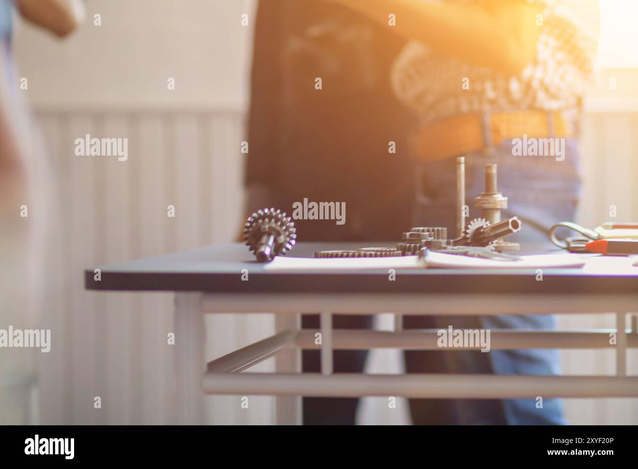 The gear set is placed on the workbench of a team of factory mechanical ...