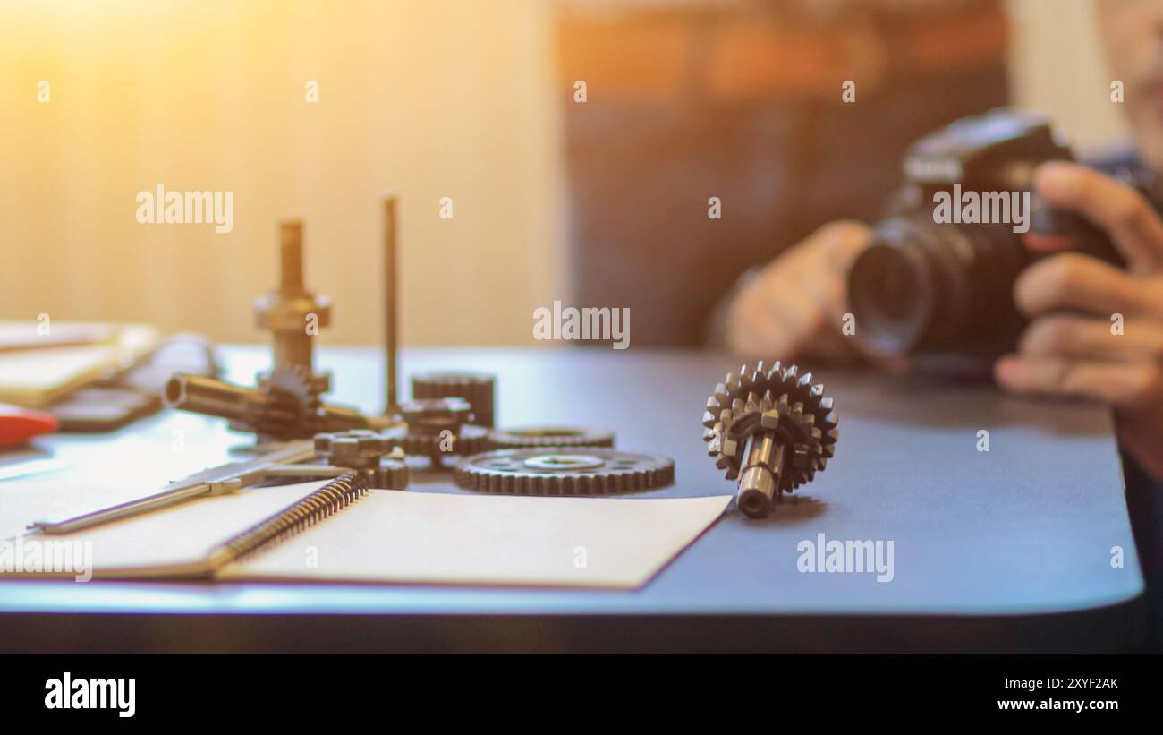 The gear set is placed on the workbench of a team of factory mechanical ...
