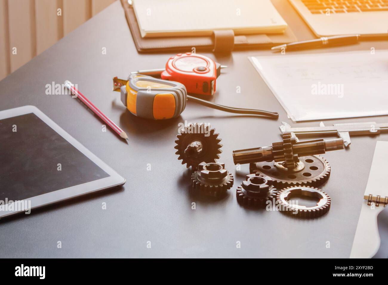 The gear set is placed on the workbench of a team of factory mechanical ...