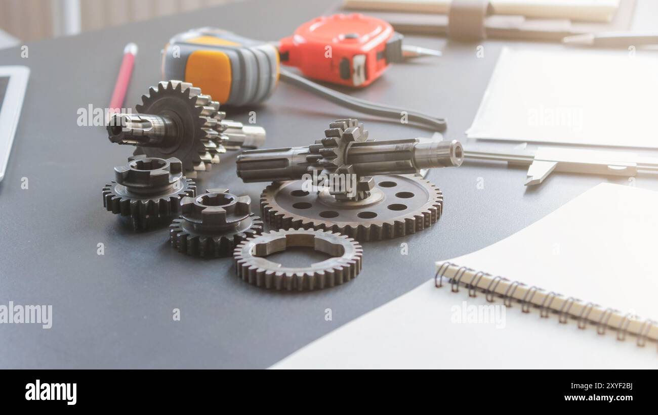 The gear set is placed on the workbench of a team of factory mechanical ...