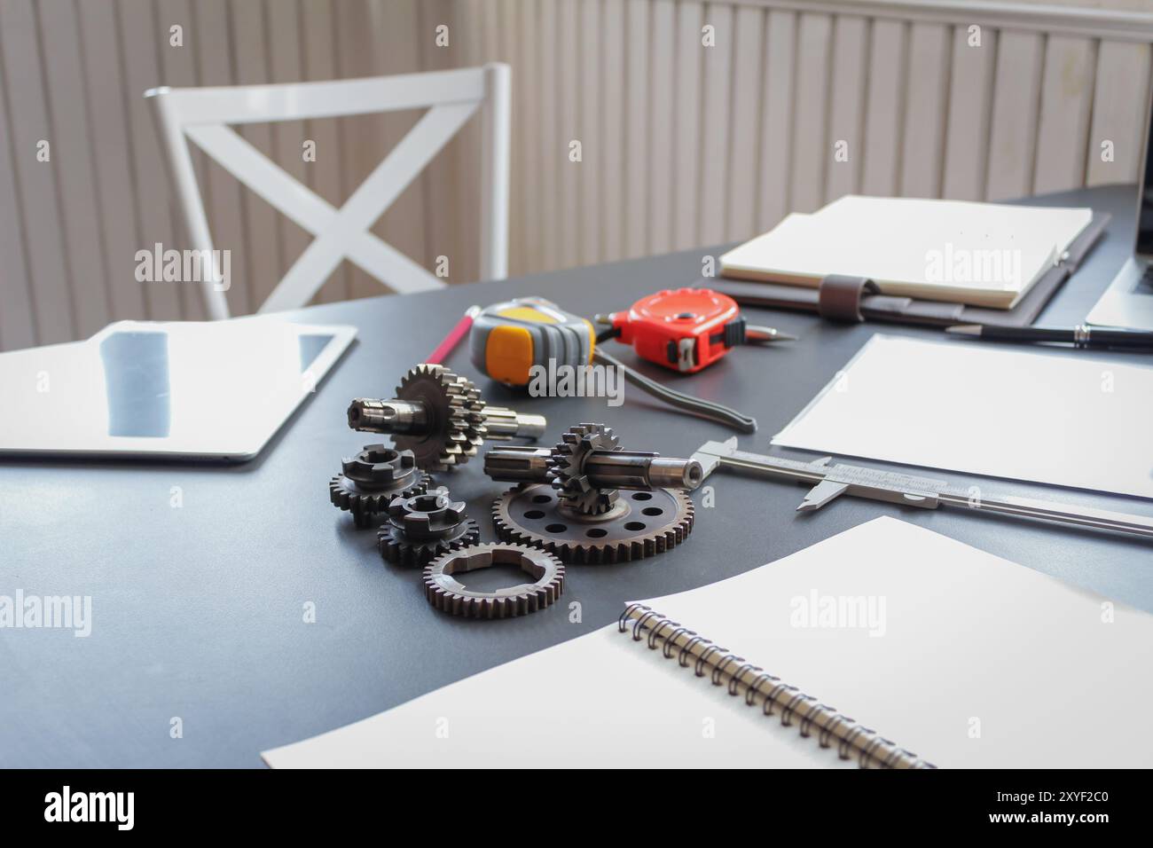 The gear set is placed on the workbench of a team of factory mechanical ...