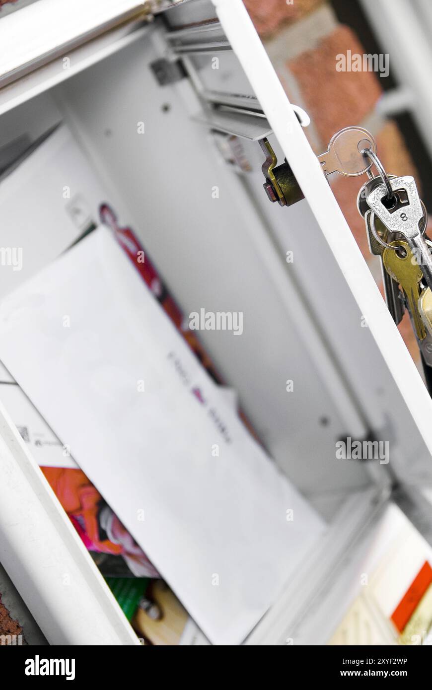 Open letterbox on house wall Stock Photo - Alamy