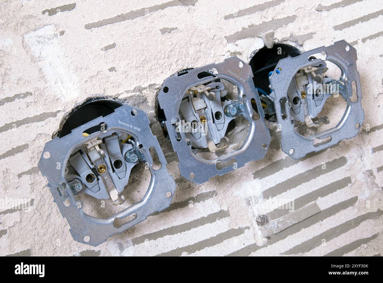 3 flush-mounted sockets Stock Photo - Alamy