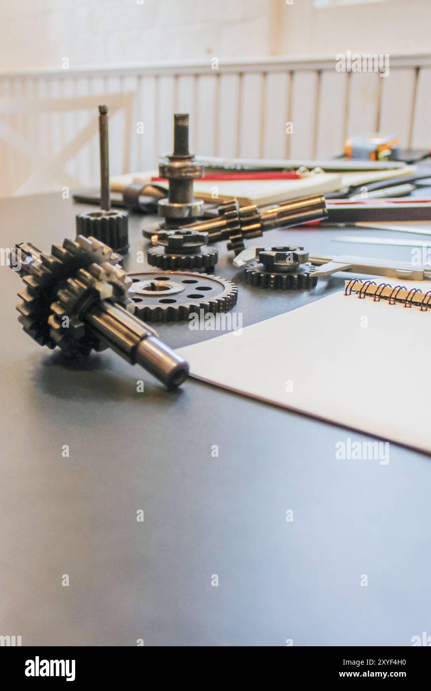 The gear set is placed on the workbench of a team of factory mechanical ...