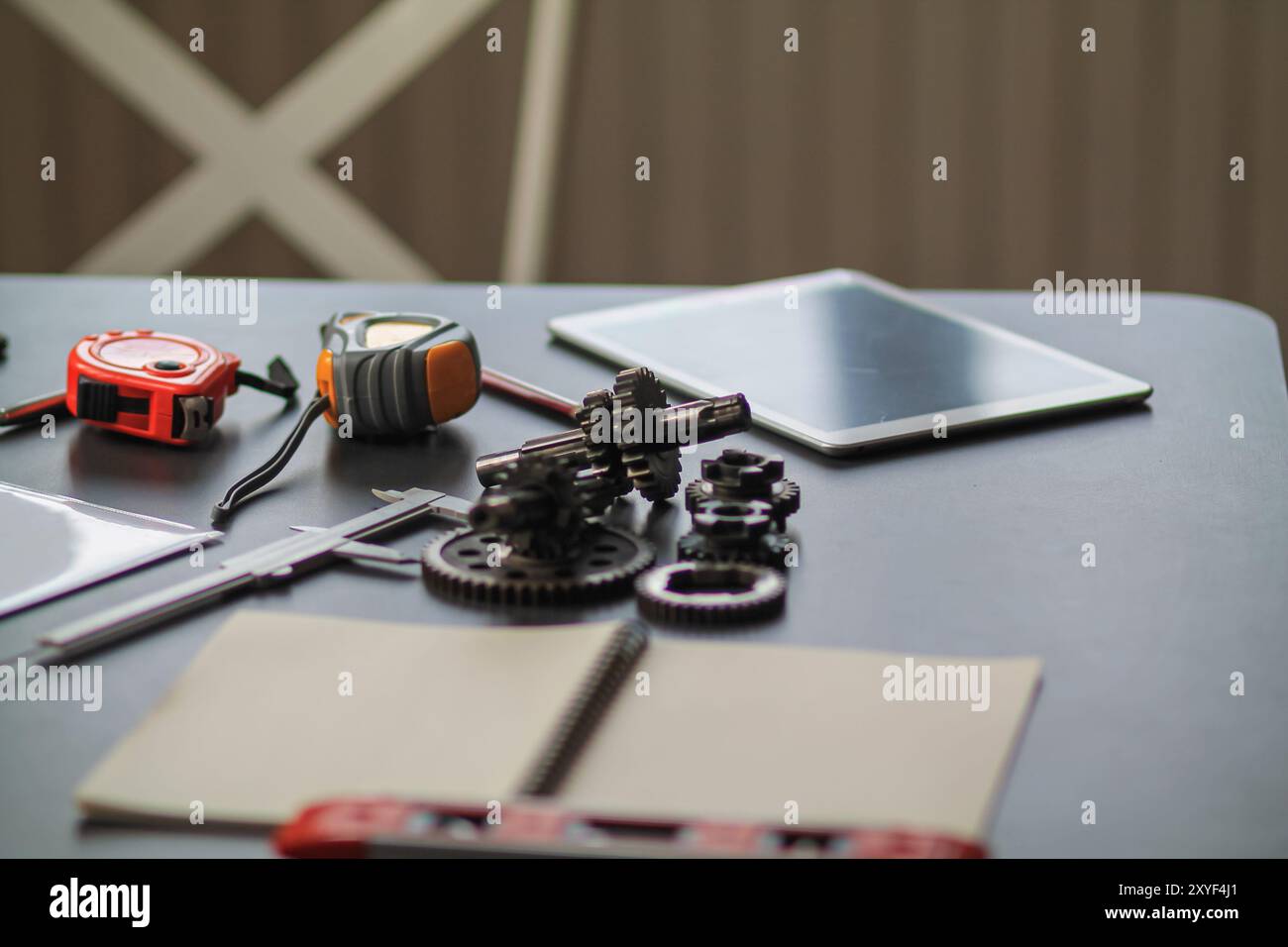 The gear set is placed on the workbench of a team of factory mechanical engineers to study and ...