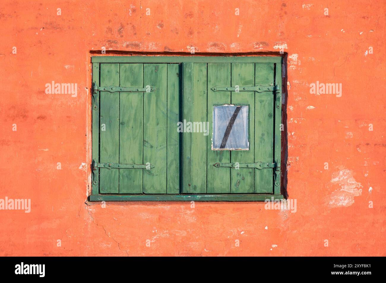 Praesto, Seeland, Denmark, July 22, 2024 - Orange wall and green wooden ...