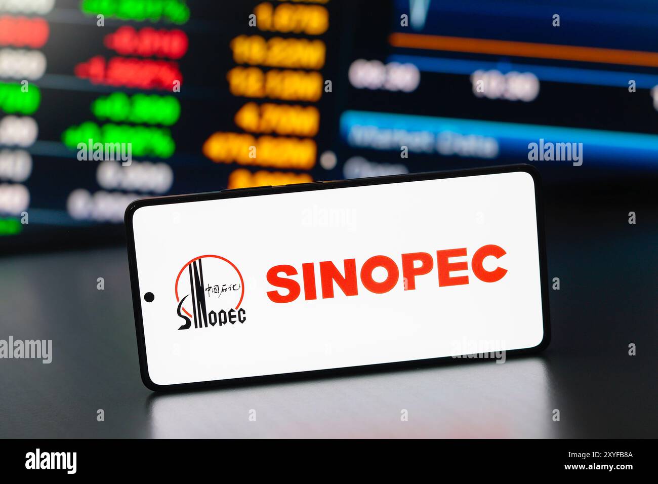 In this photo illustration, the Sinopec logo is displayed on a ...
