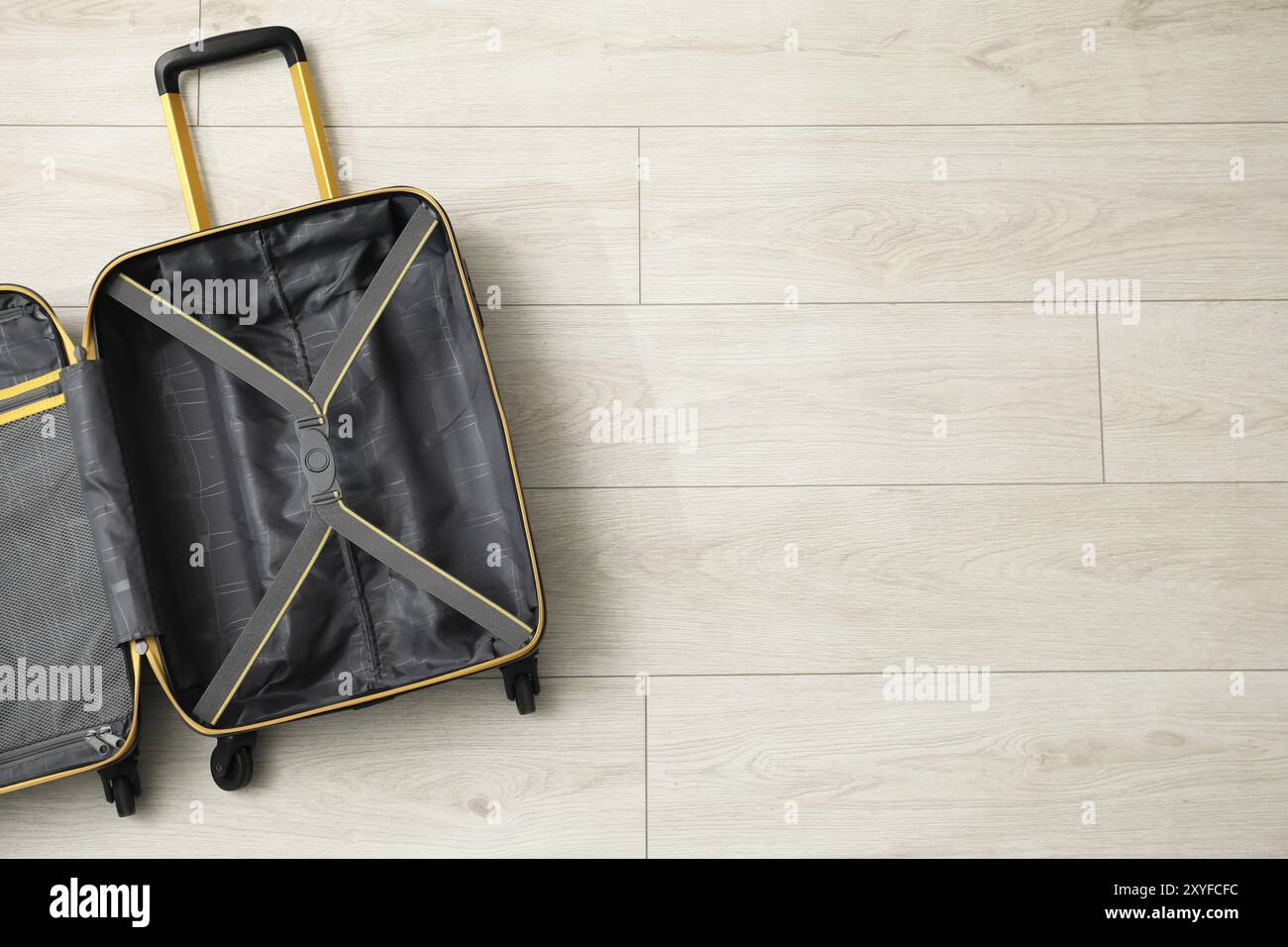 Open empty suitcase on floor indoors, top view. Space for text Stock ...