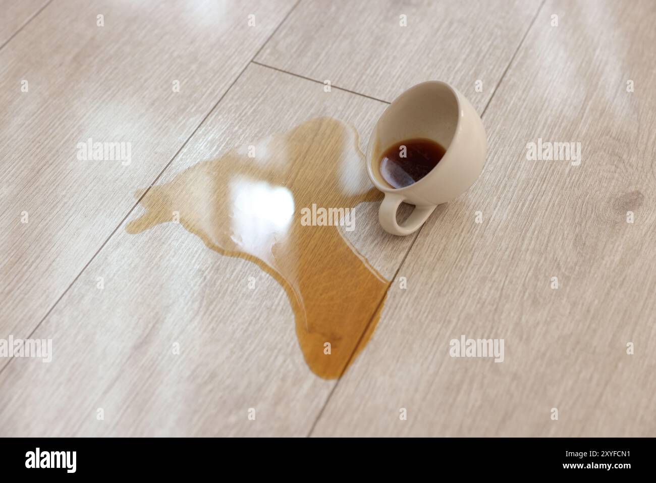 Cup coffee spilled wooden floor hi-res stock photography and images - Alamy