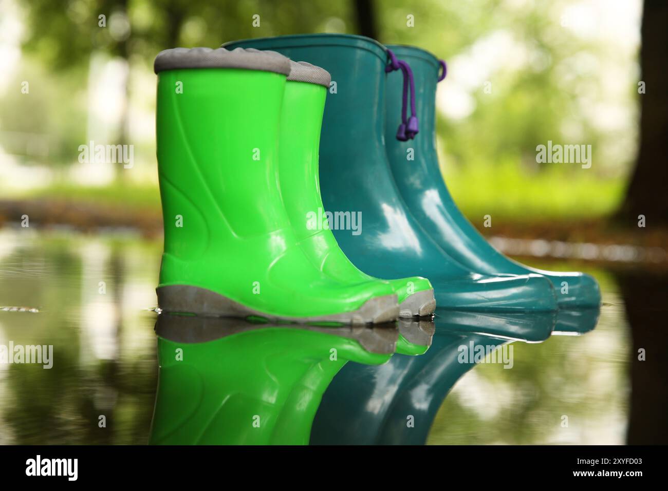 Toddler with rubber boots hi-res stock photography and images - Alamy