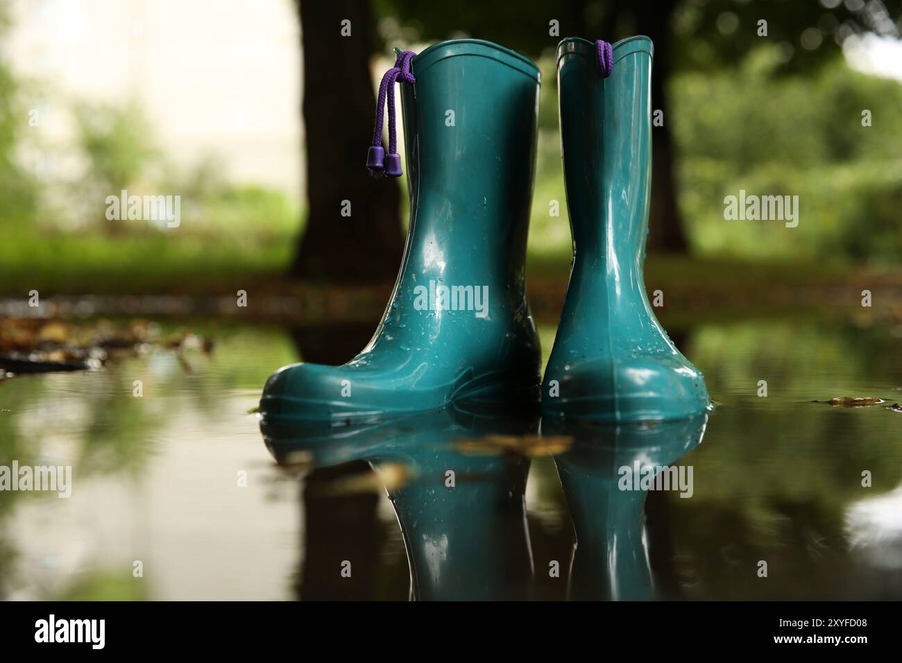 Toddler with rubber boots hi-res stock photography and images - Alamy