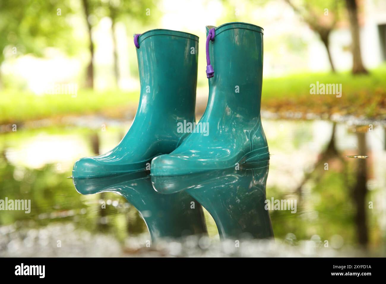 Toddler with rubber boots hi-res stock photography and images - Alamy