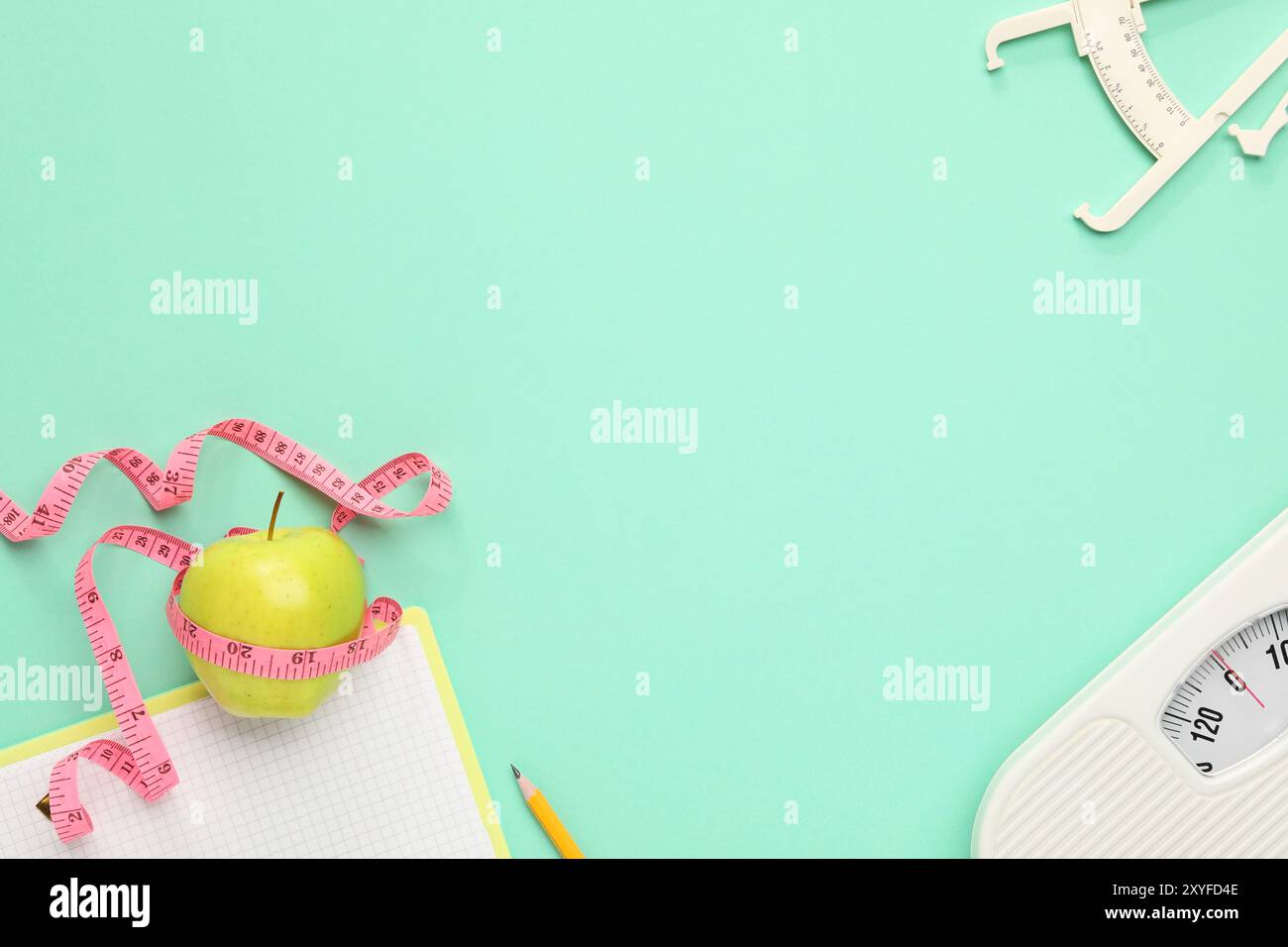 Flat lay composition with body fat caliper and measuring tape on ...