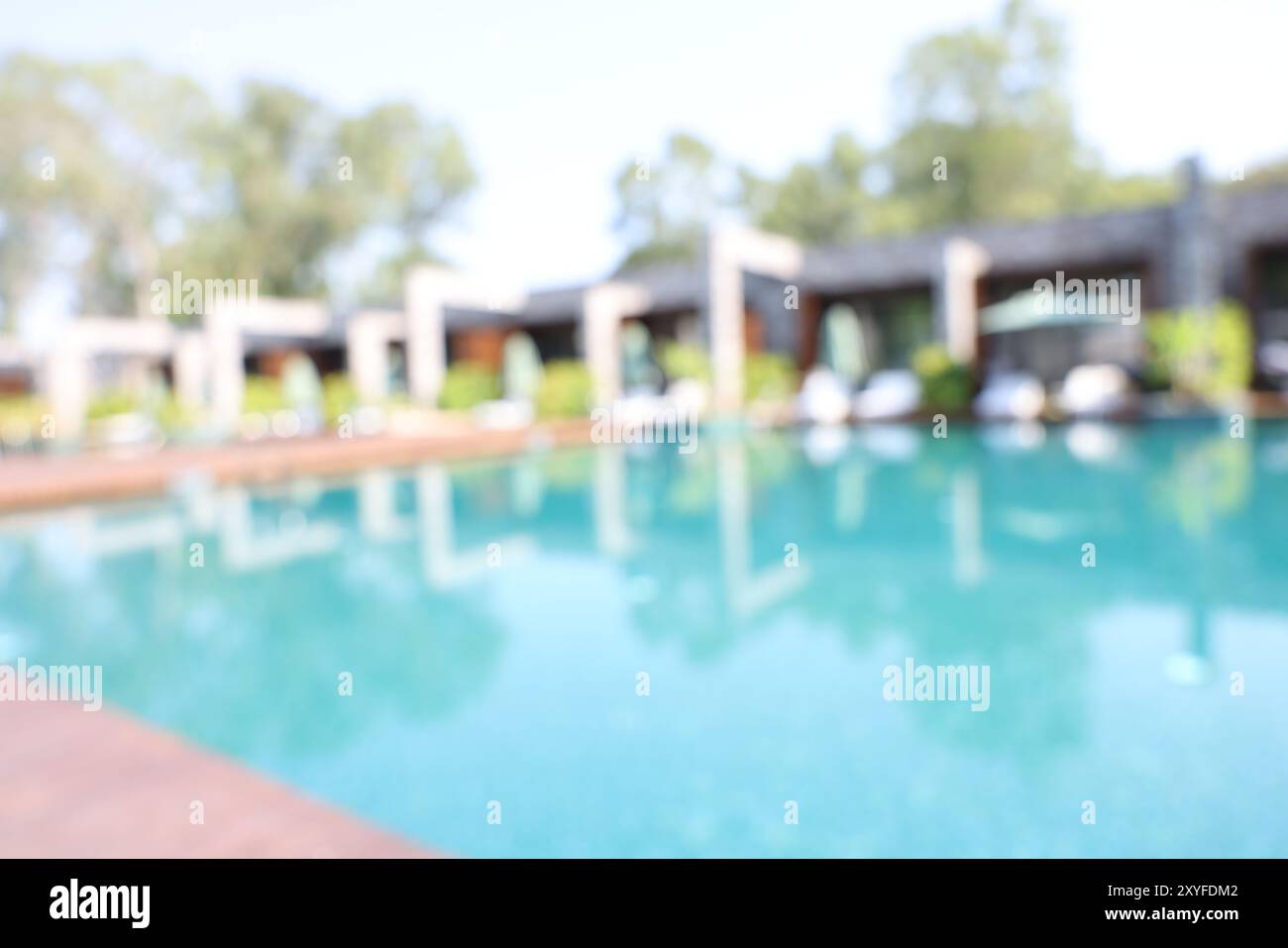 Blurred view of outdoor swimming pool at luxury resort Stock Photo - Alamy