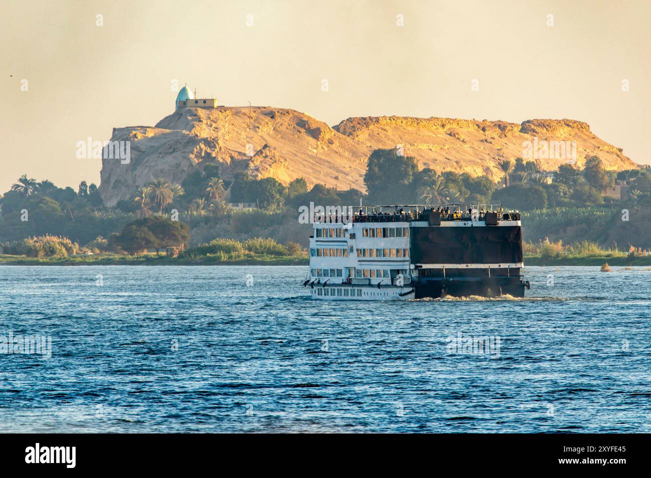 Discover the beauty of a boat sailing the Nile, surrounded by ...