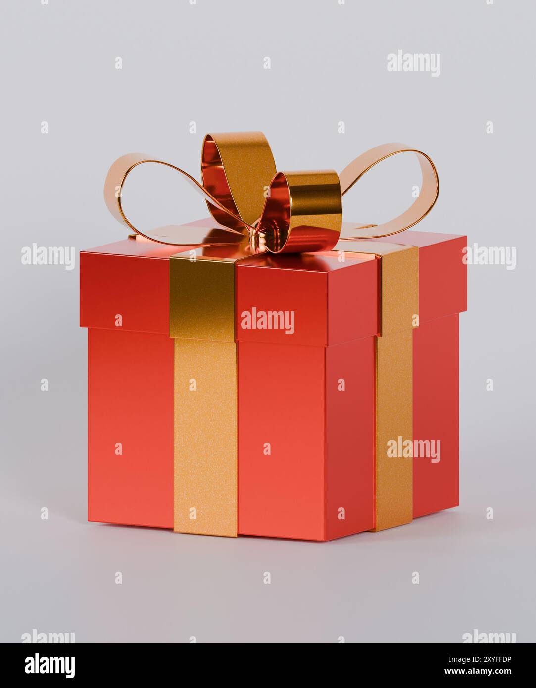 Red gift box with a golden bow Stock Photo - Alamy