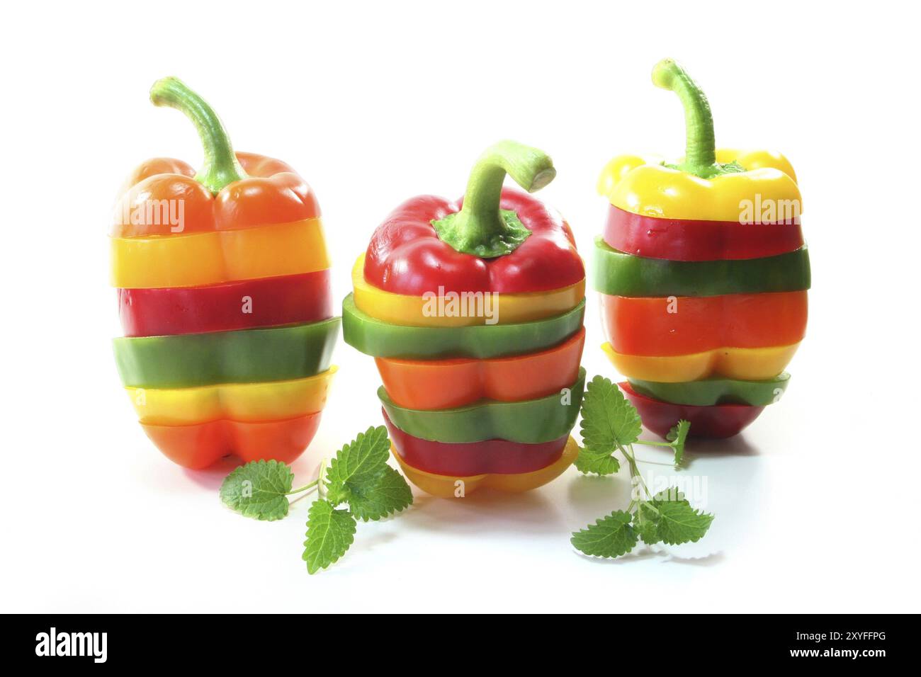 Different coloured peppers layered on a white background Stock Photo ...