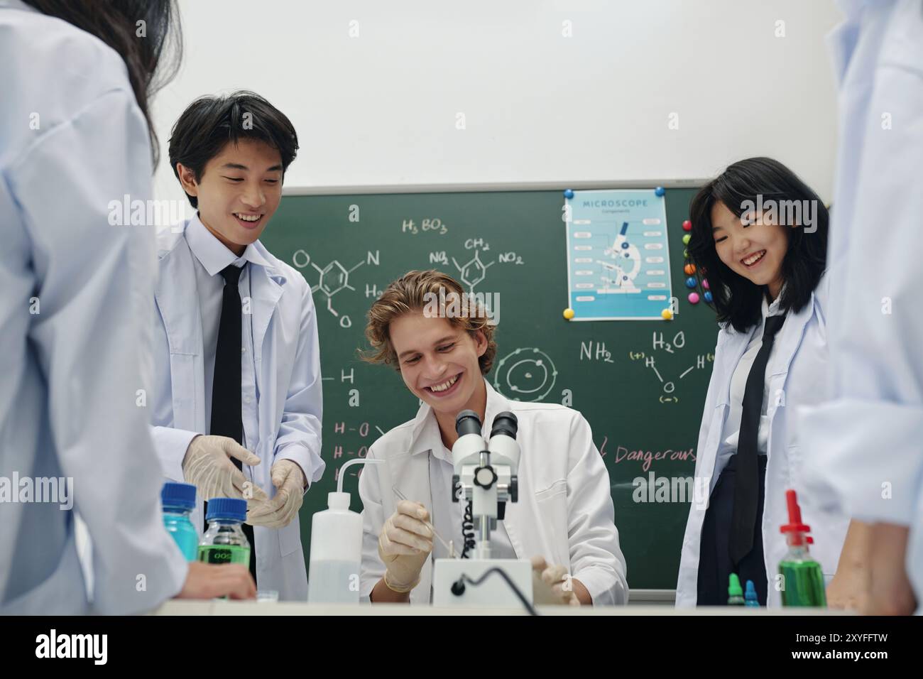 Conducting Scientific Experiment in Classroom Setting Stock Photo - Alamy
