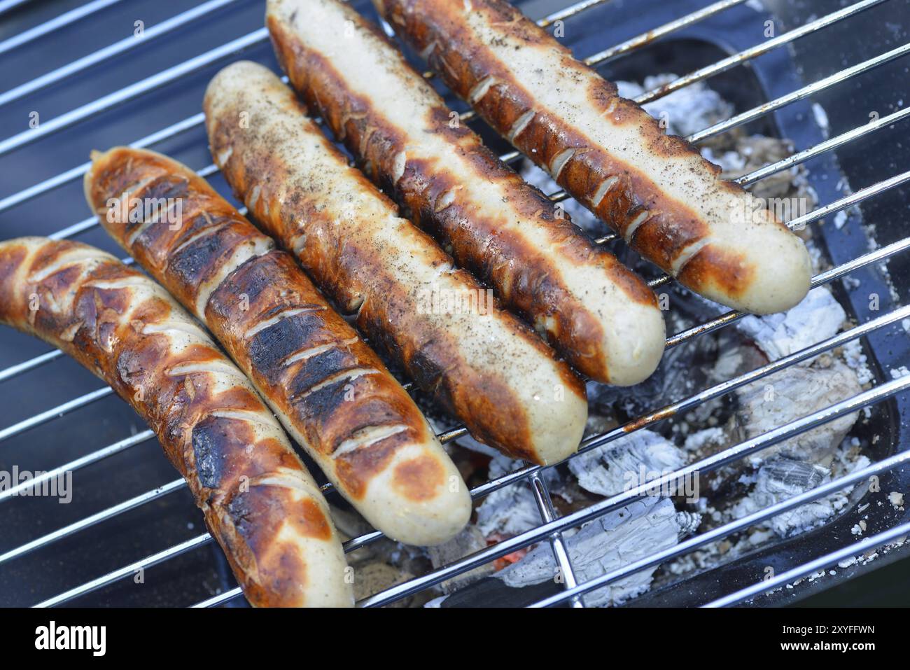 Bratwuerste auf dem Grill. Bratwurst is a type of German sausage ...
