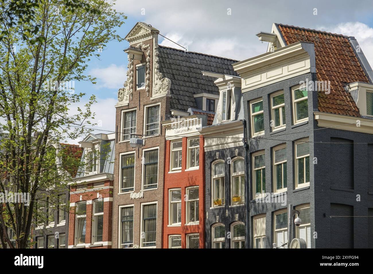 Row of historic buildings with ornate gables and windows surrounded by ...