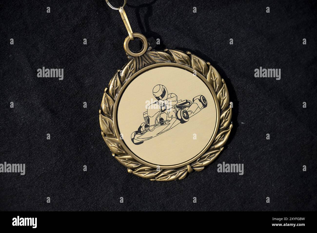 Medal for go-kart racing competition on black fabric Stock Photo - Alamy