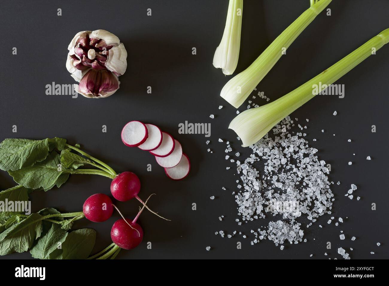 Fresh sliced radish, red garlic, celery and salt seen from above Stock ...
