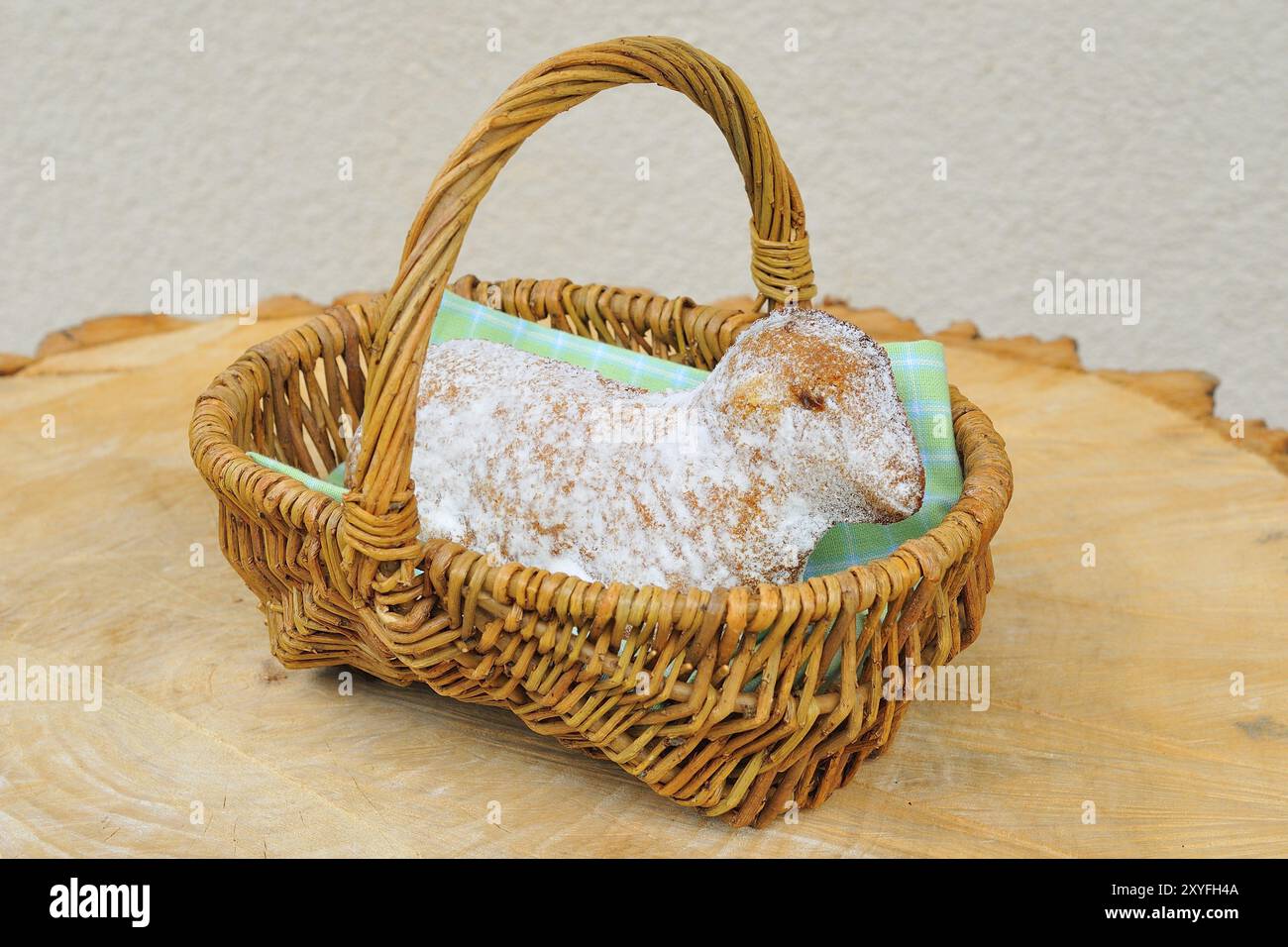 Baked lamb-shaped dough. Baked Easter lamb in a raffia basket Stock ...