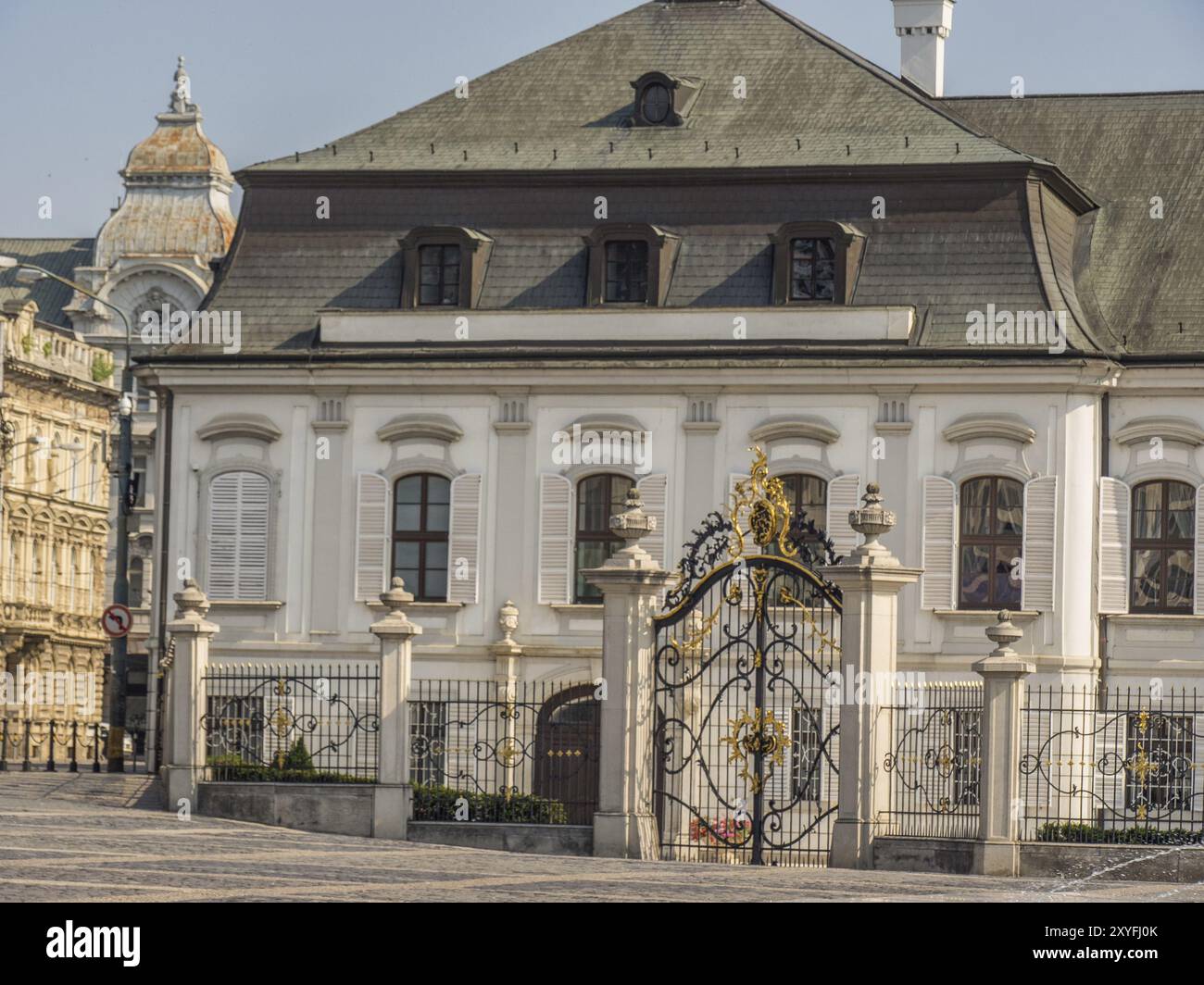 Historic building with ornamental gate and fence in a cityscape on a ...