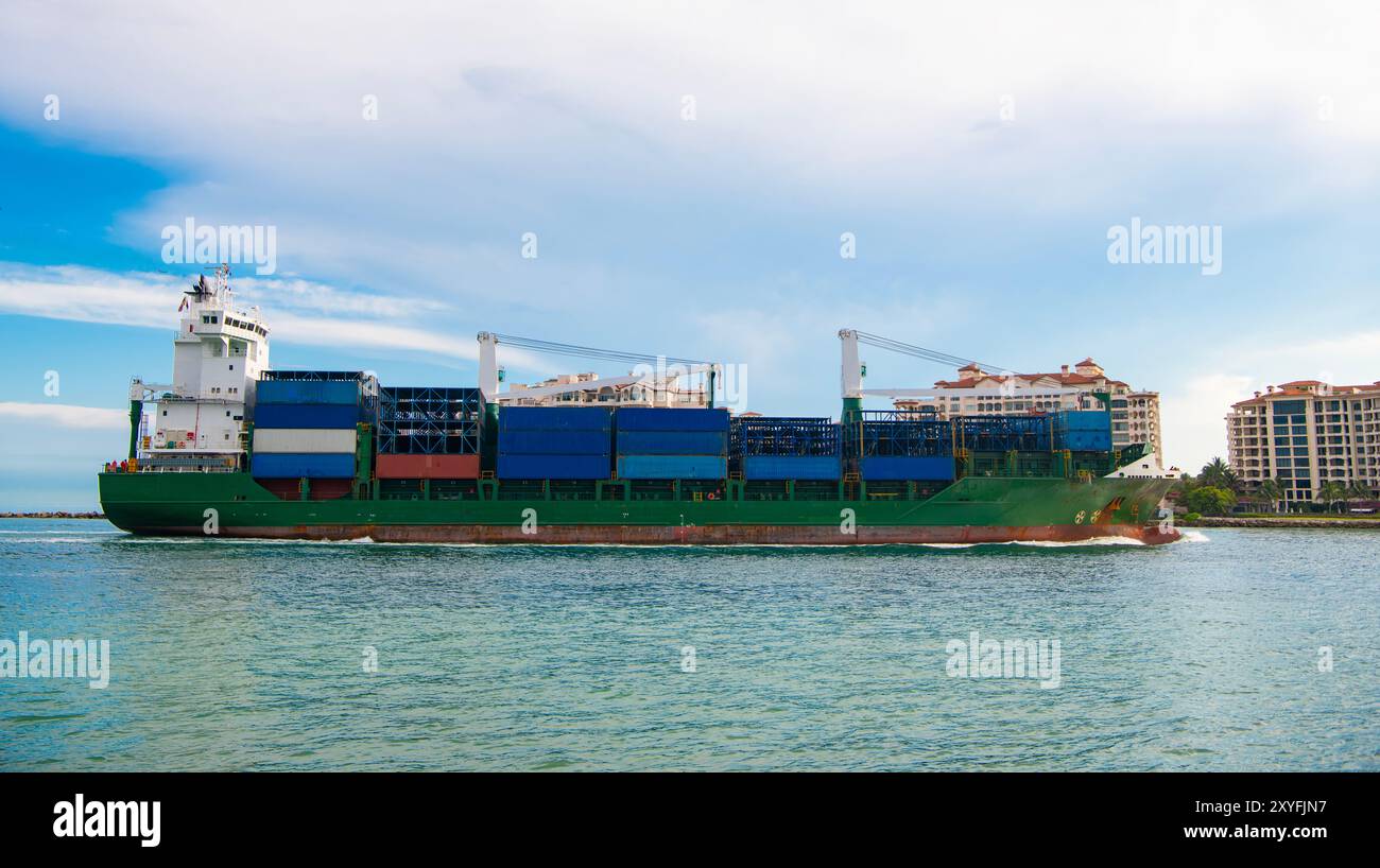 Freight container loaded on cargo vessel in Miami, Florida. Cargo ship ...