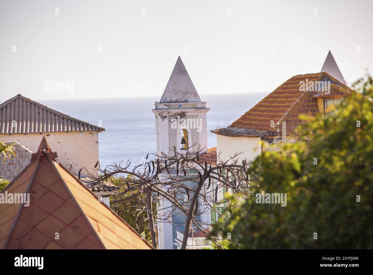 Towers of a church between red roofs Stock Photo - Alamy