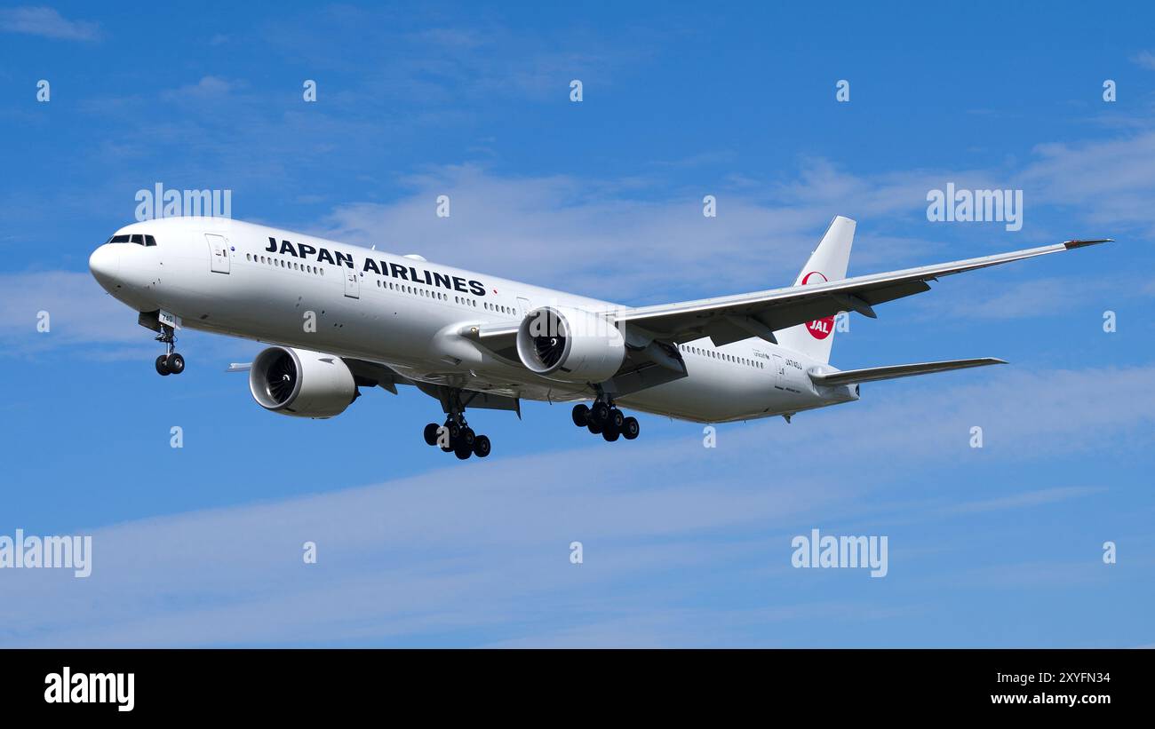Japan Airlines JAL Boeing 777 coming into land with a blue sky. London ...