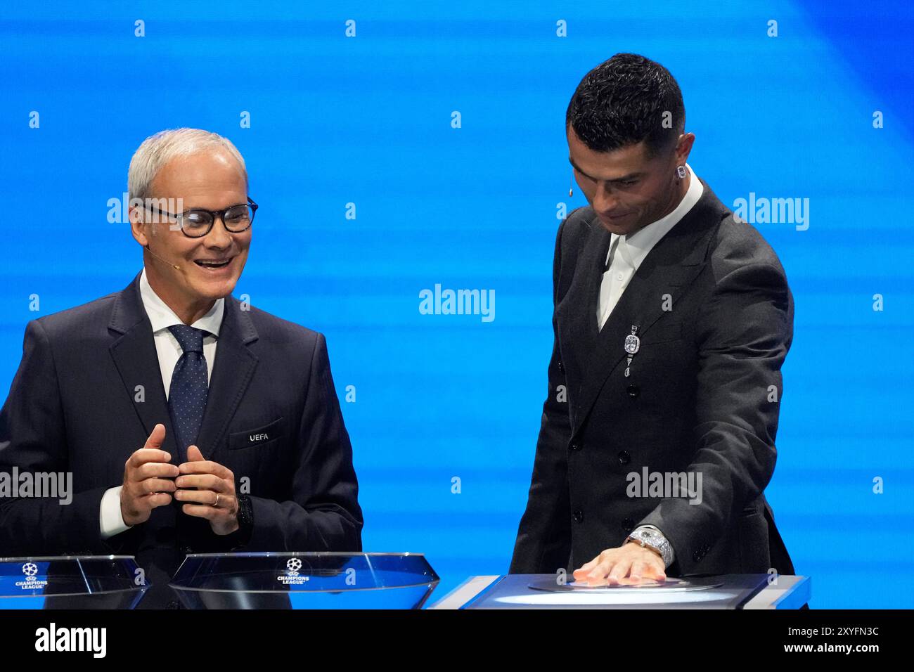 UEFA's Giorgio Marchetti watches player Cristiano Ronaldo press a ...