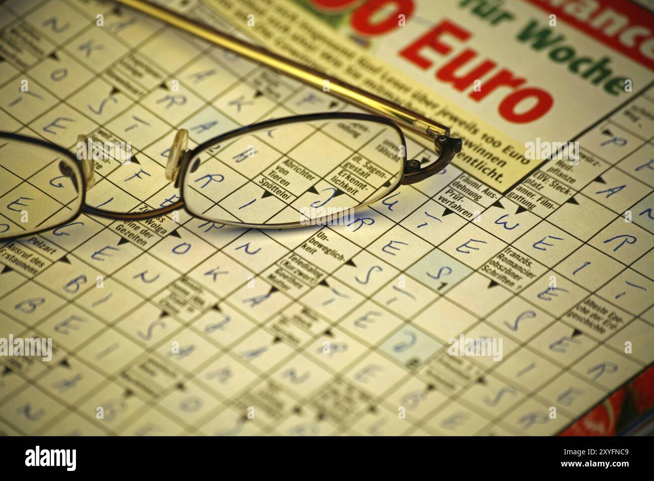 Magazine with crossword puzzle and glasses Stock Photo - Alamy