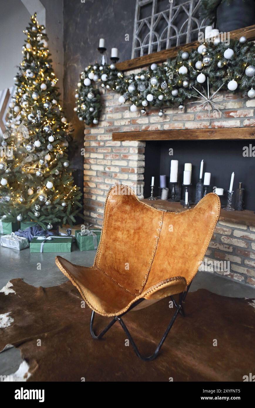 Christmas decorated fireplace and tree in the loft room Stock Photo - Alamy