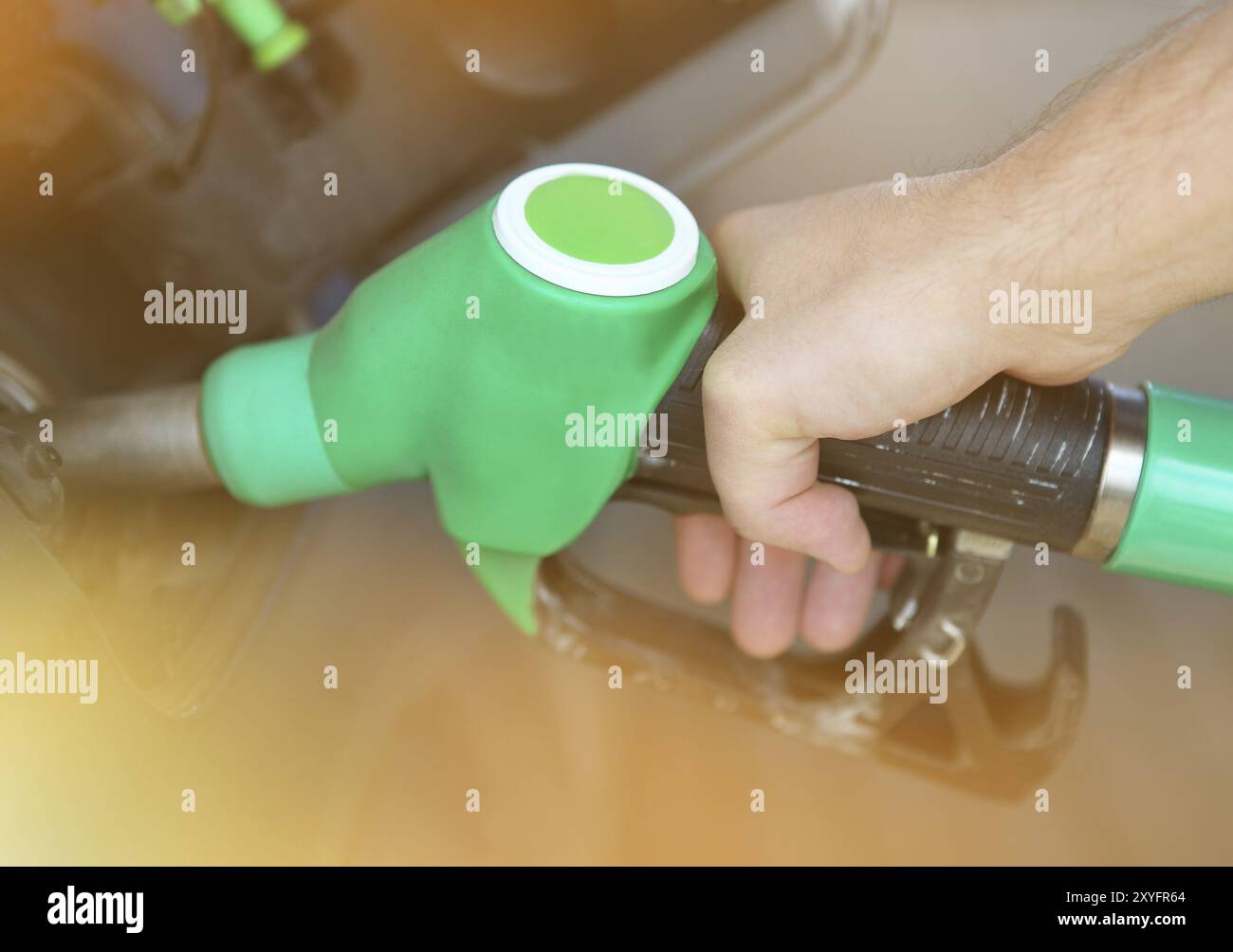 Close up of a hand of a man refilling the car with a gas pump Stock ...